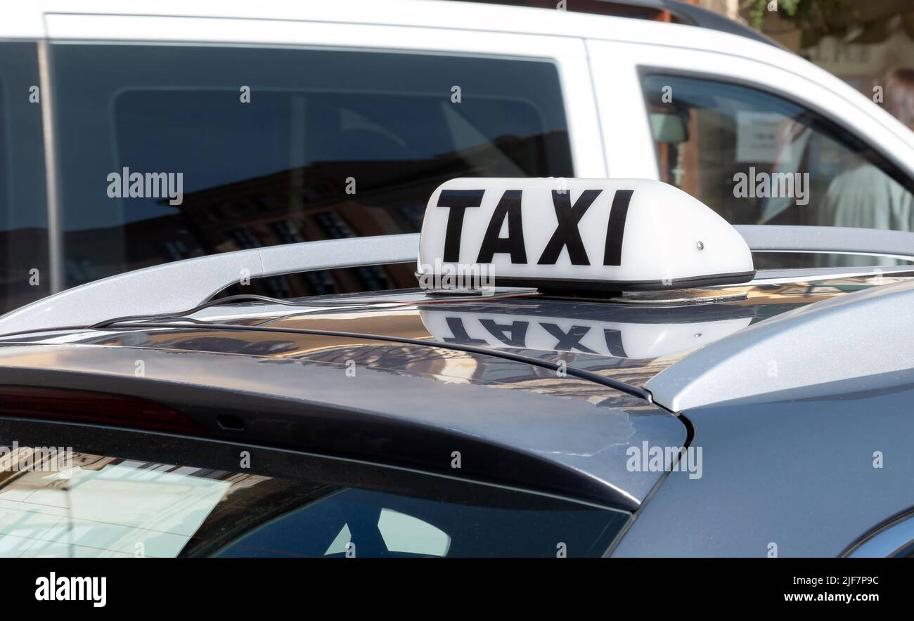 Simple traditional taxi cab car roof top sign, white object up close ...