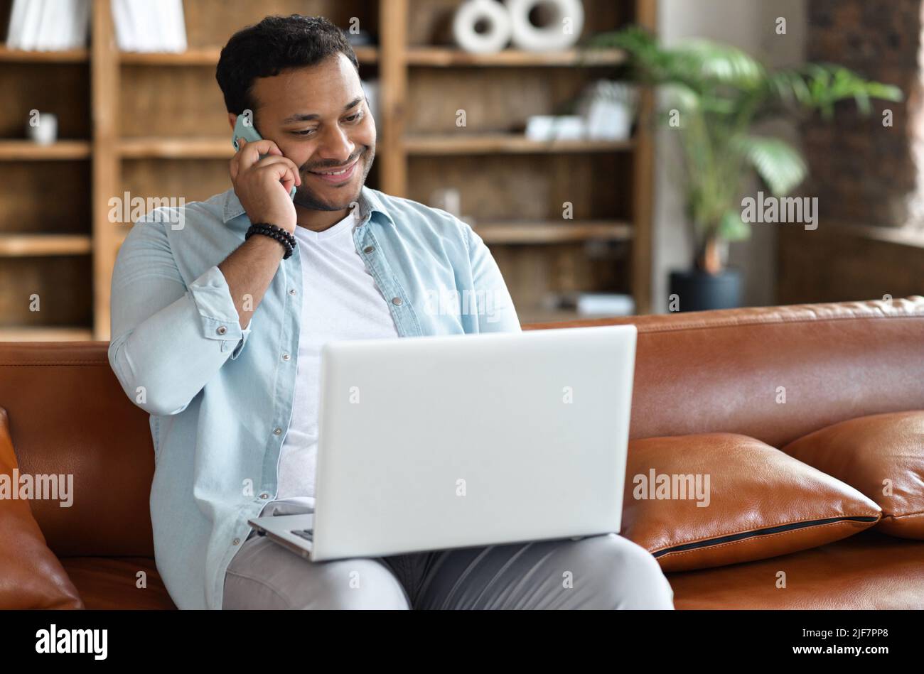 Indian freelancer guy in casual wear using laptop computer for remote ...