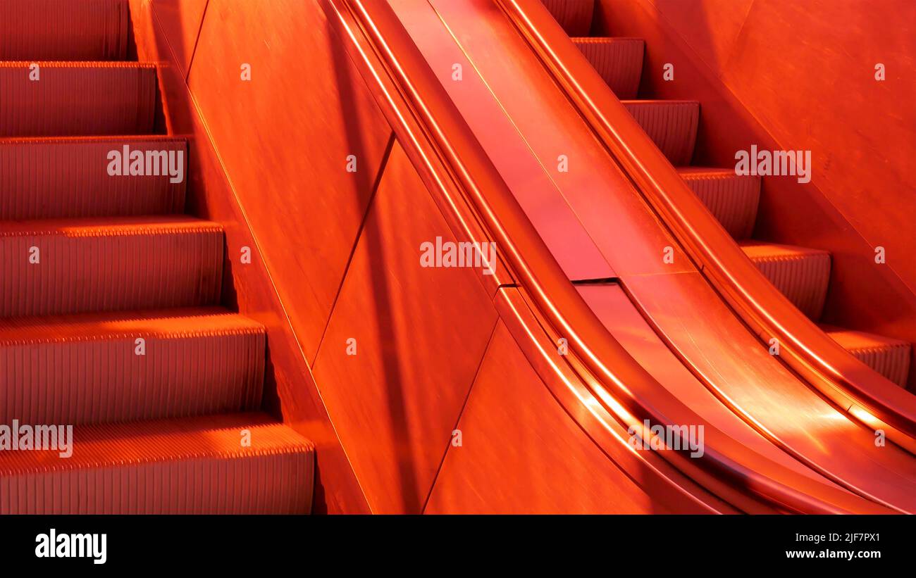 Escalator with bright red lighting, stairs, red light exterior moving ...