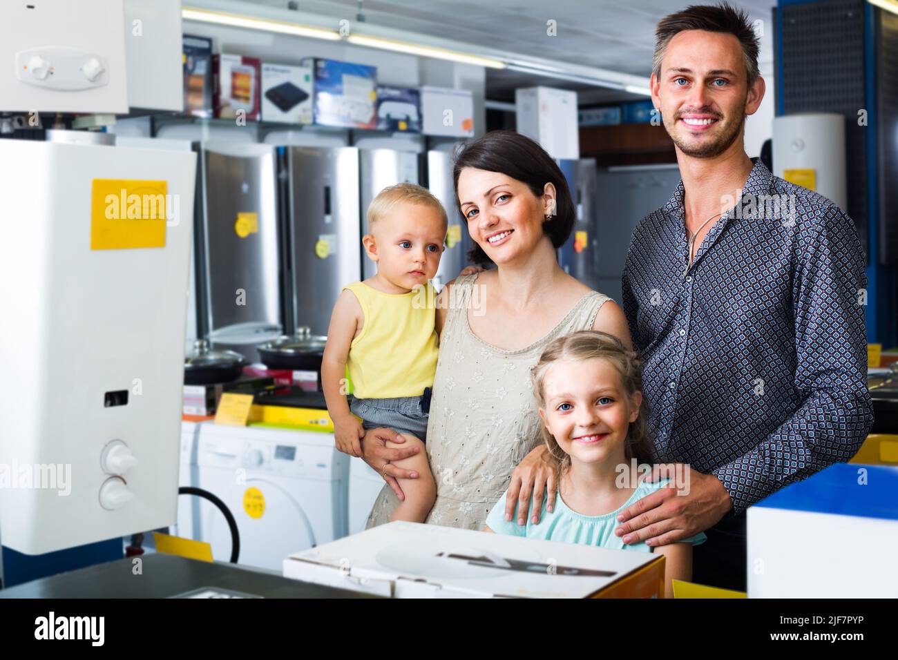 parents with kids in store Stock Photo - Alamy