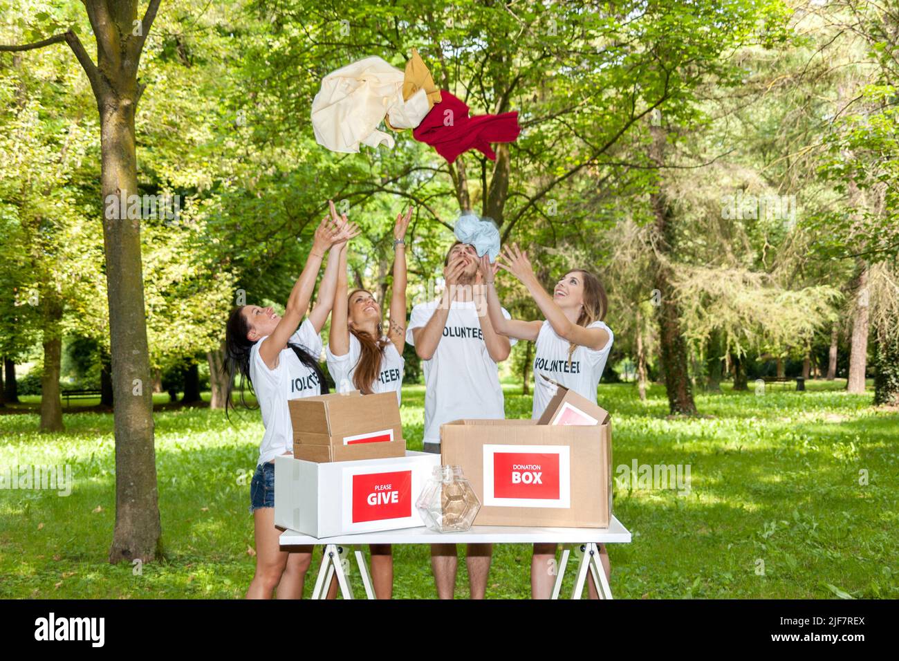 group of teenagers volunteering celebrate sales Stock Photo - Alamy