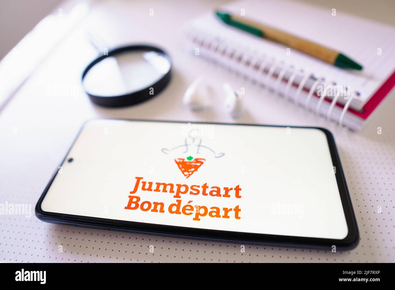 In this photo illustration the Jumpstart Bon Depart logo seen displayed ...