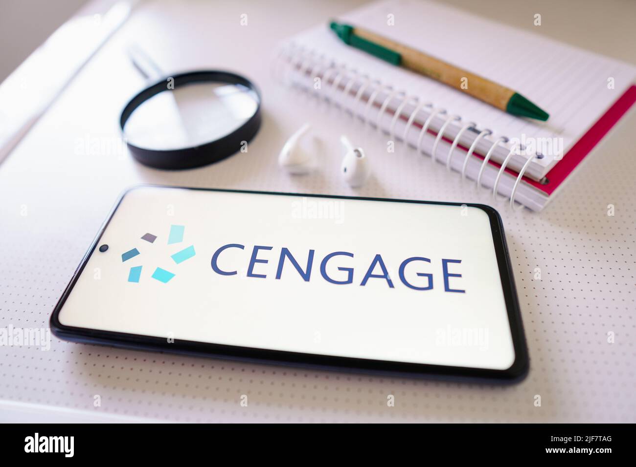 In this photo illustration the Cengage Learning logo seen displayed on ...