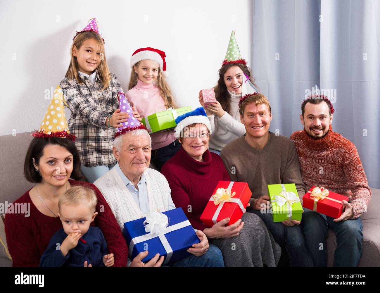 Cheerful family making numerous photos Stock Photo - Alamy
