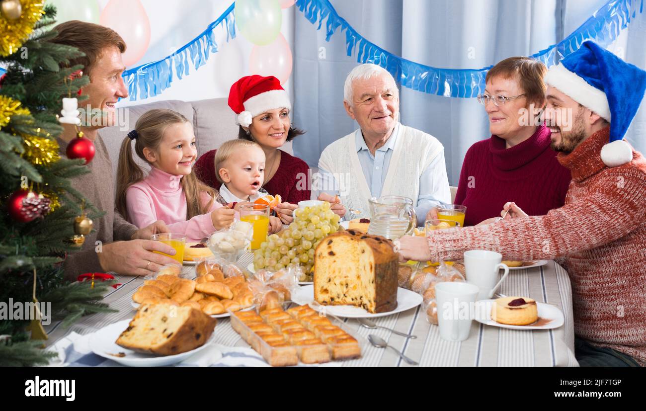 Laughing family members making conversation Stock Photo - Alamy