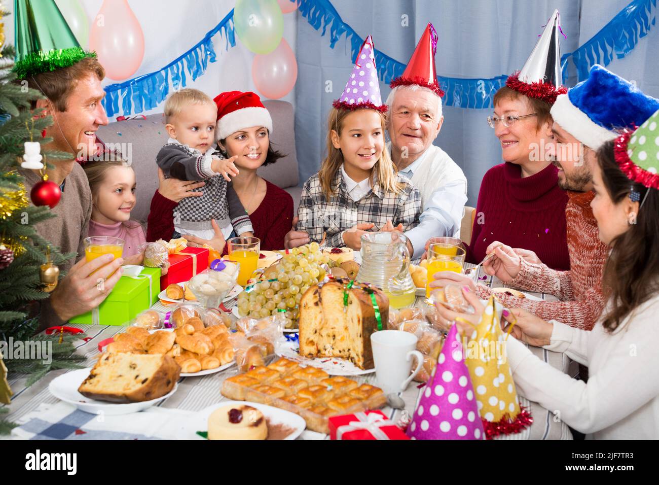 Adults with children are saying toasts to each other Stock Photo - Alamy