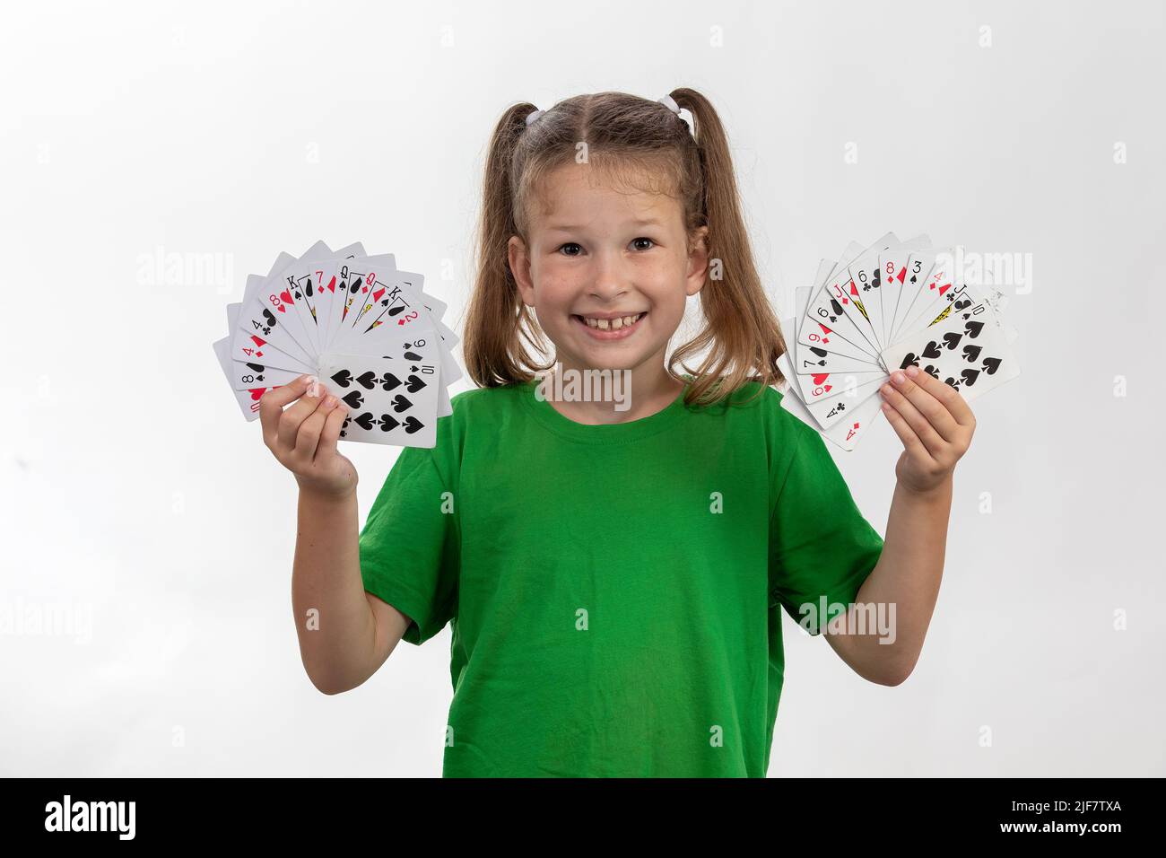 Close-up portrait of caucasian girl with playing cards. Isolated on ...