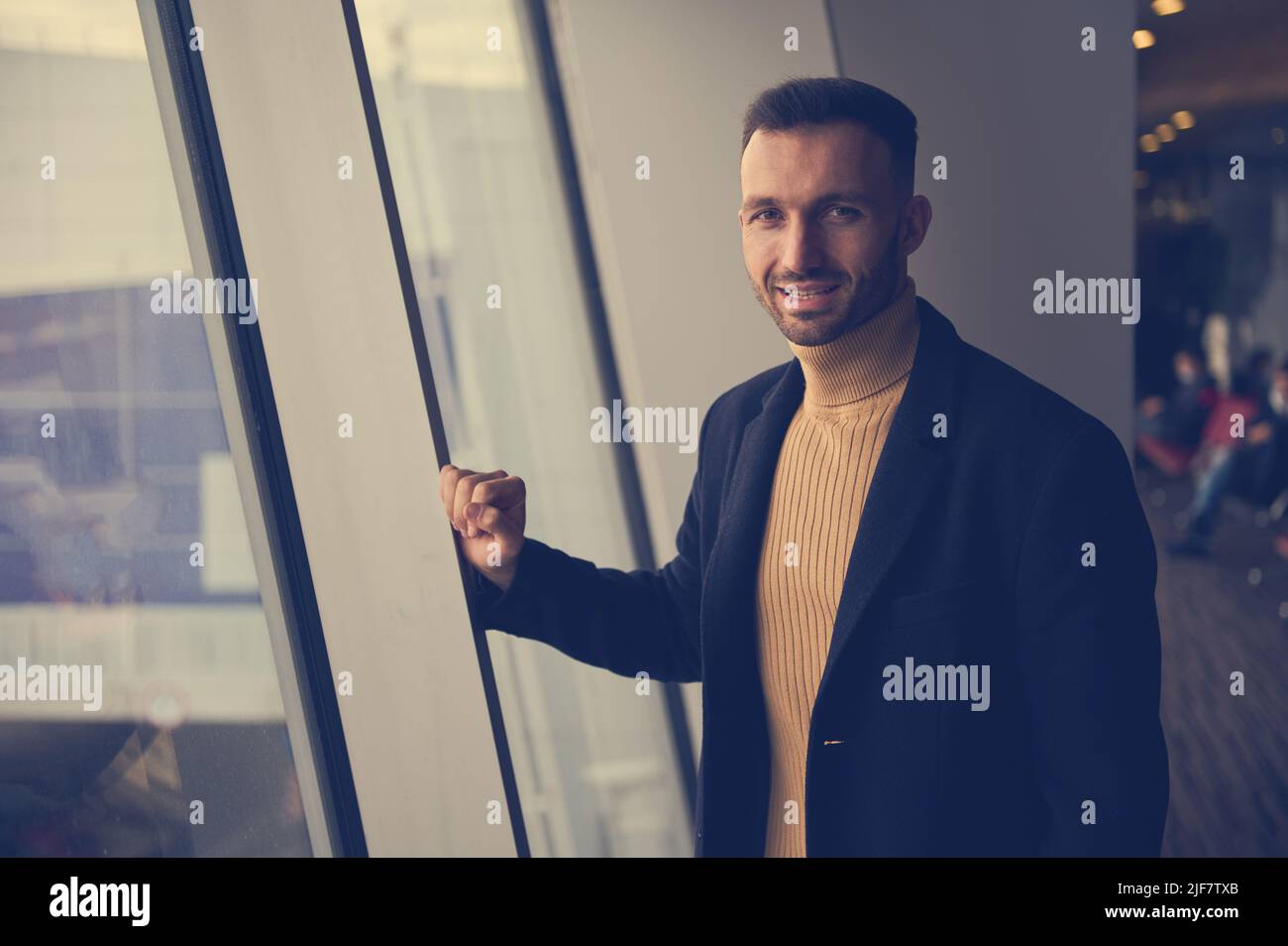 Toned photo, portrait of a handsome young man, transit passenger ...