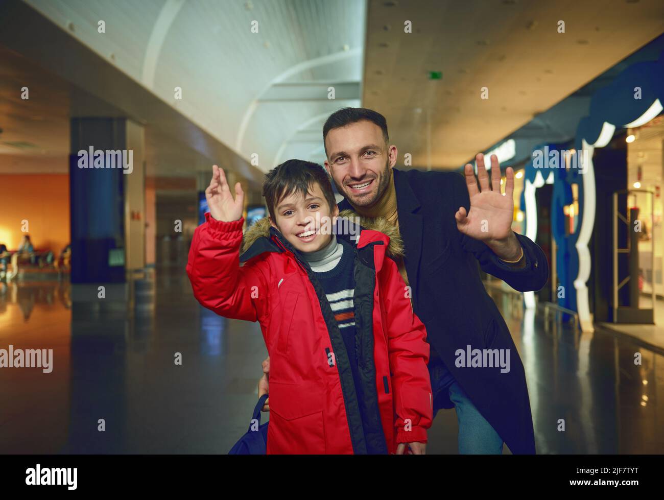 Handsome Middle Eastern man father and his adorable son, passengers ...