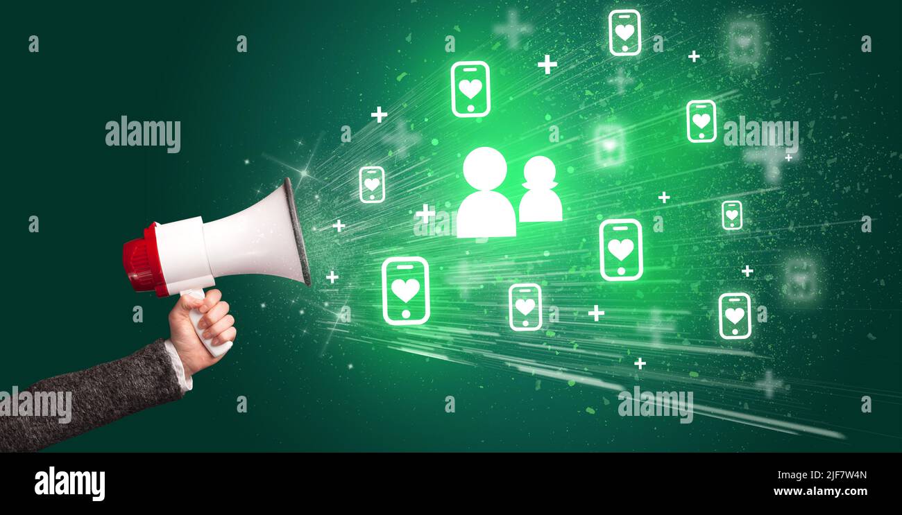 Young person with megaphone and social networking icon Stock Photo - Alamy