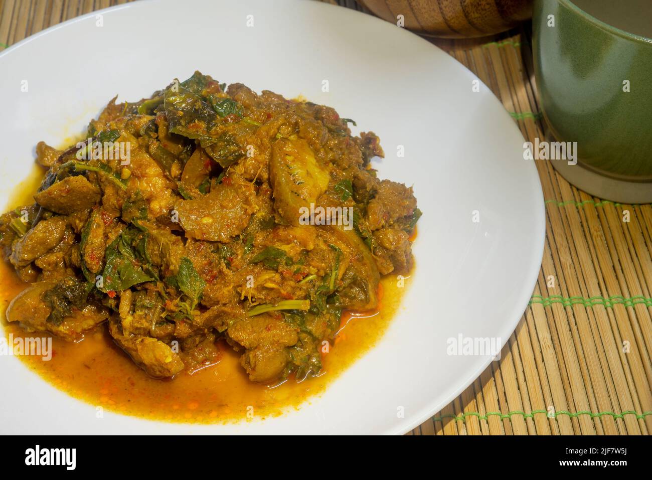 Spicy stir-fried wild boar in a white dish. Thai food, spicy stir-fried ...