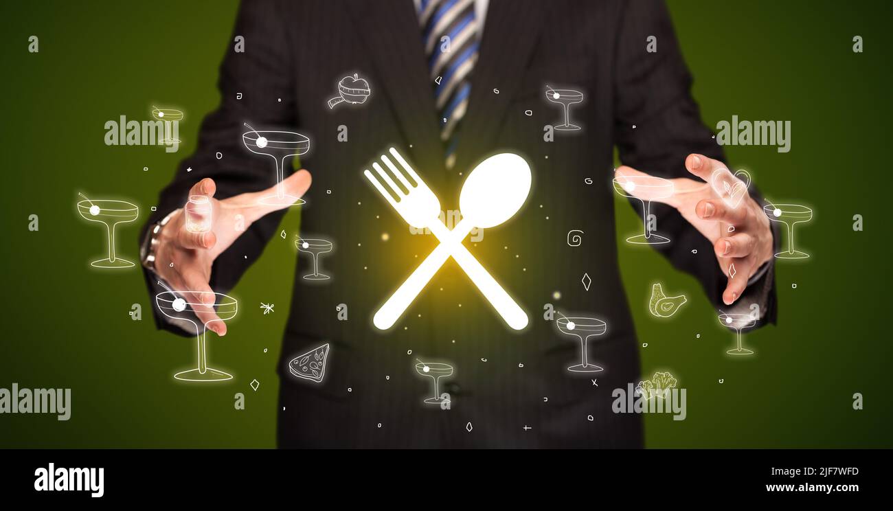 Hand holding food related icons Stock Photo - Alamy