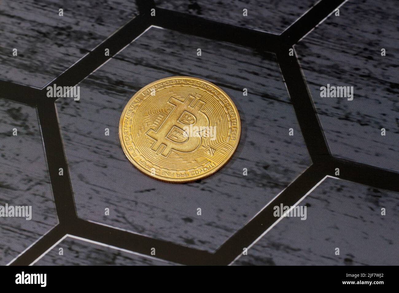 bitcoin gold coin on hexagon dark gray background. Online payment ...