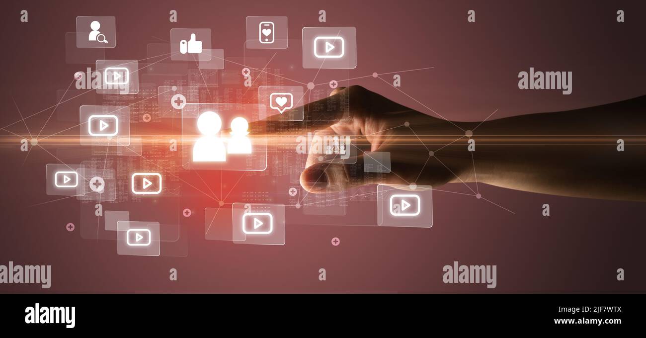 Hand pressing social media multimedia application screen with media ...