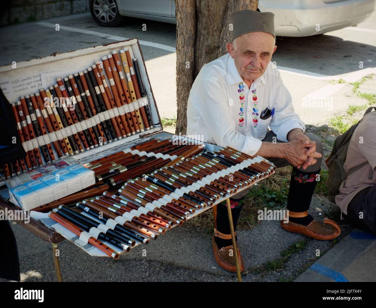 old man traditional costume sells frula, serbian flute, the traditional ...