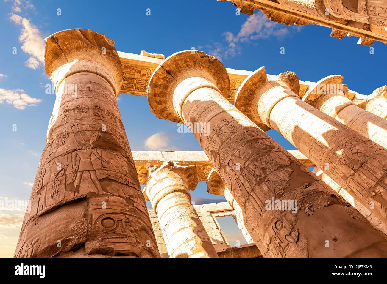 Columns with ancient carvings in the Great Hypostyle Hall of Karnak ...