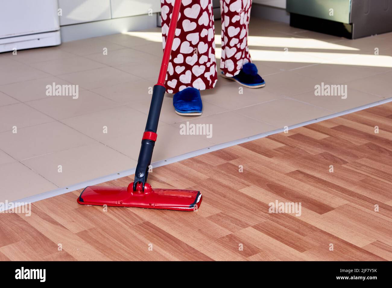 Sweeping mopping floor kitchen hi-res stock photography and images - Alamy
