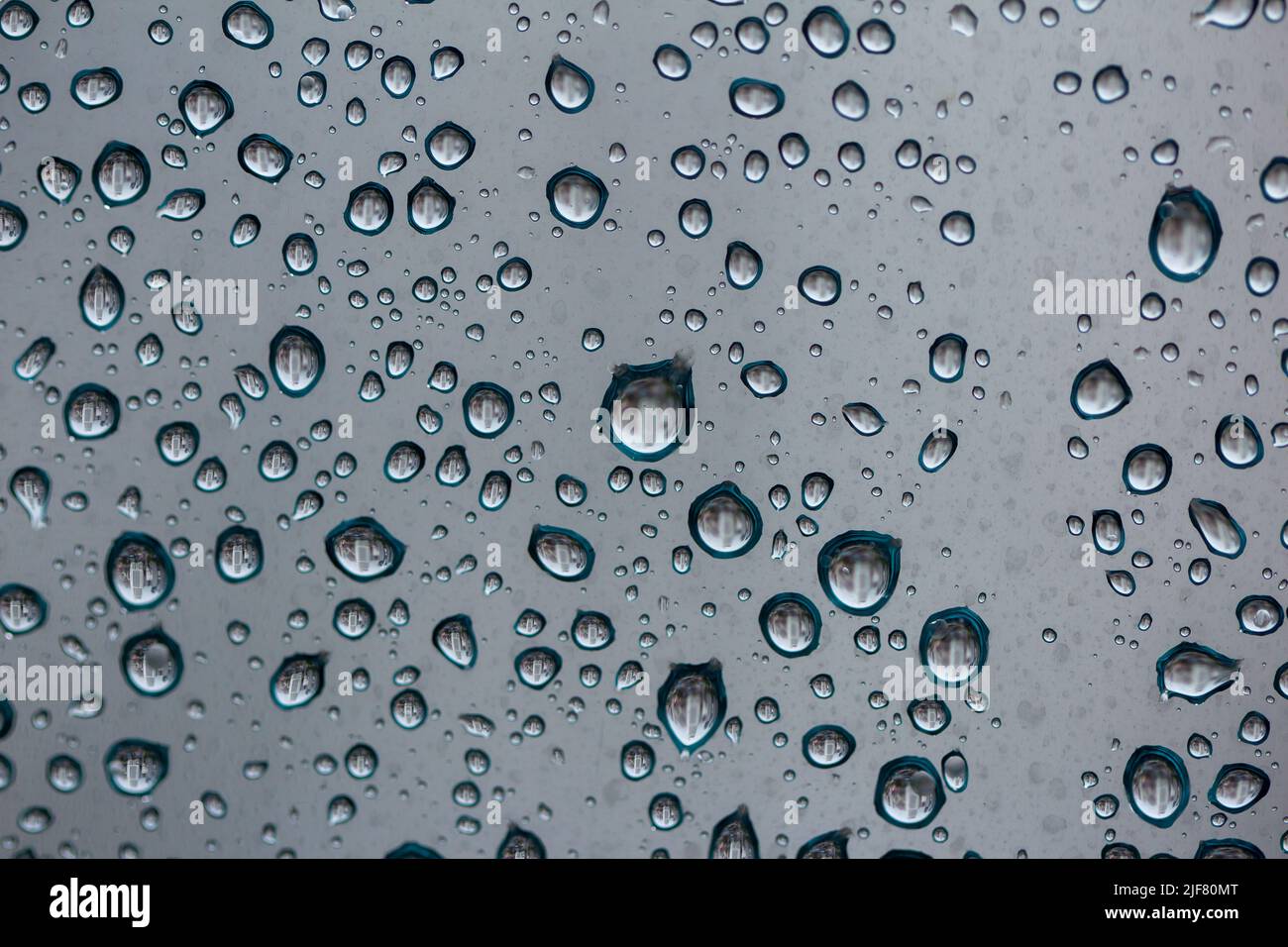 View of rain drops over window glass after a rain storm Stock Photo - Alamy