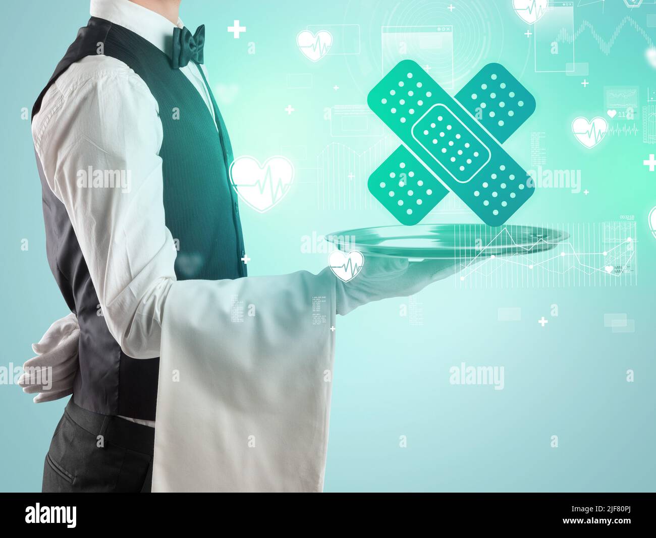 Handsome young waiter in tuxedo holding healthcare icons on tray Stock ...