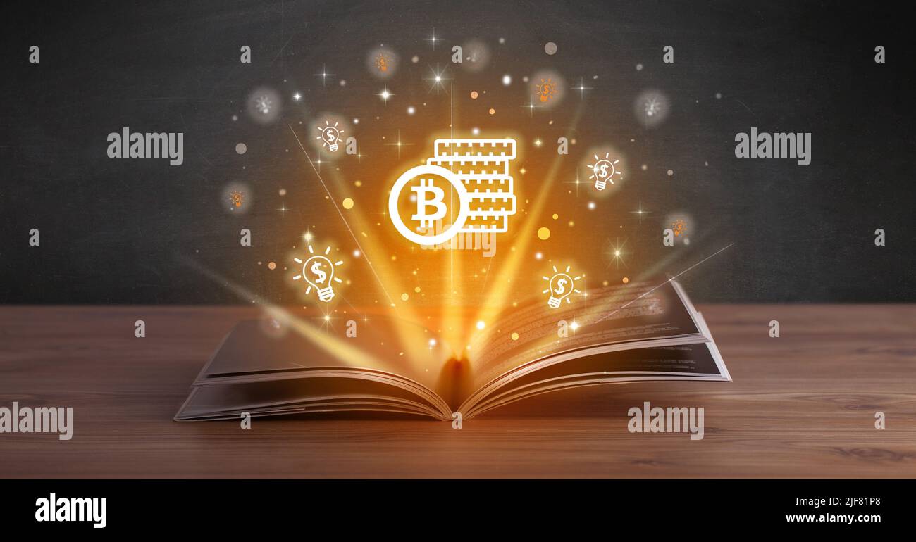 Open book with currency icons above Stock Photo - Alamy