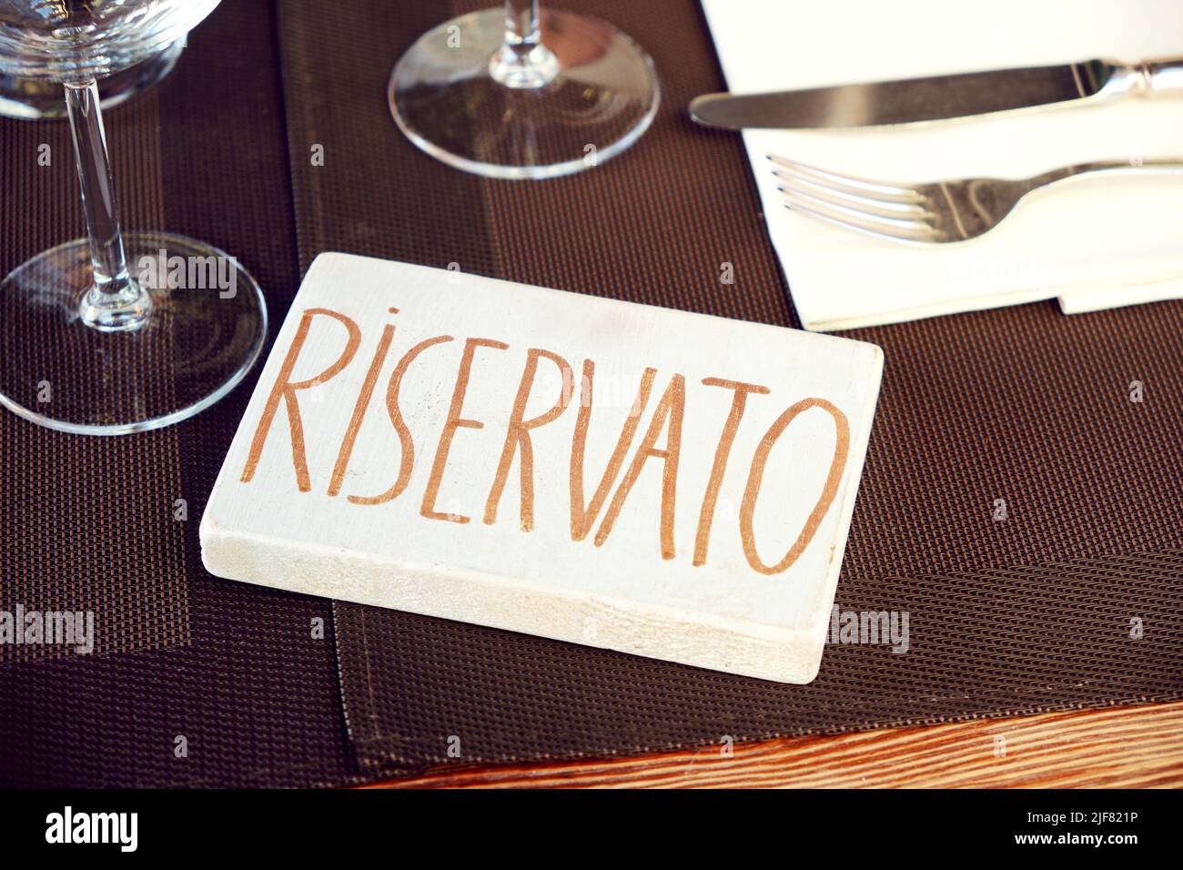 Reserved sign in Italian language on a table in restaurant Stock Photo ...