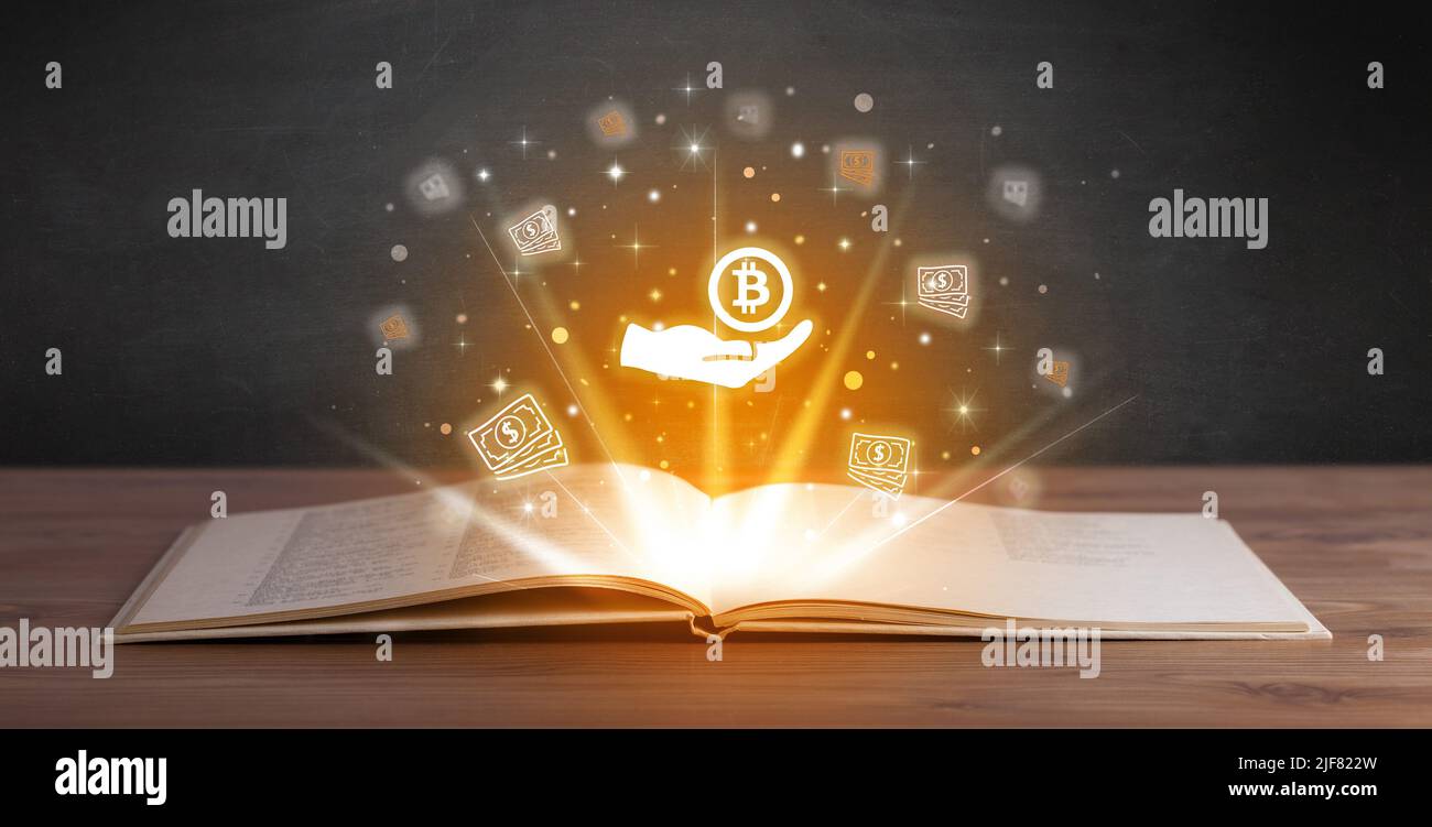 Open book with currency icons above Stock Photo - Alamy