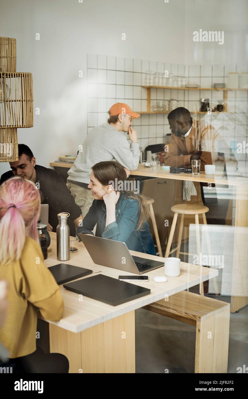 Computer programmers working together in tech start-up office Stock ...