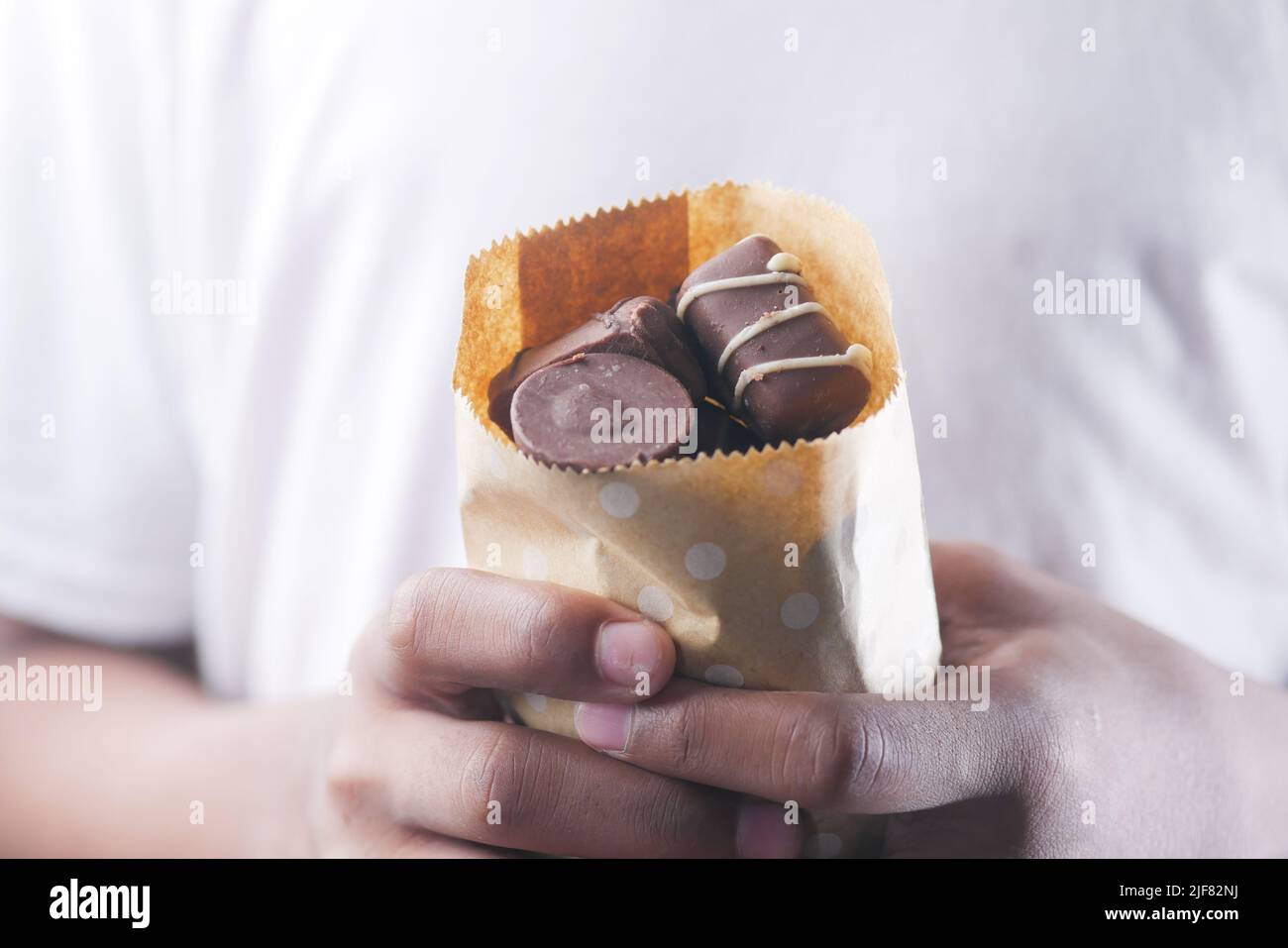 Dark chocolate in paper packet hi-res stock photography and images - Alamy