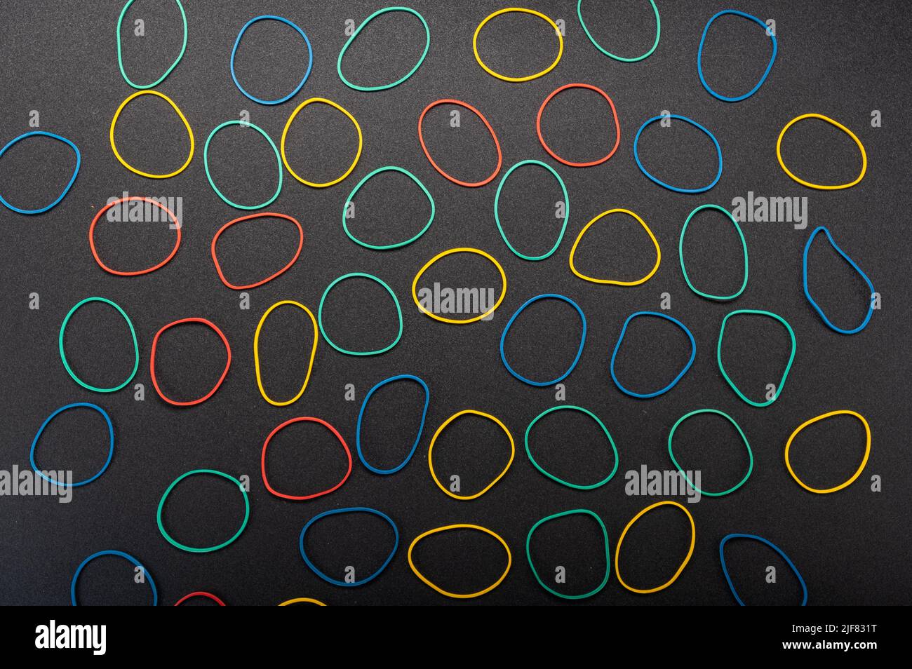 Background from a set of multi-colored circles. Black background and ...