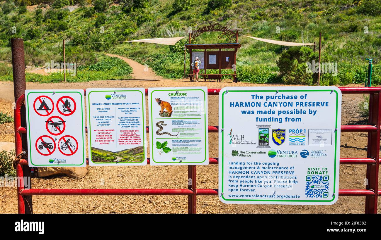 Interpretive signs and hiker at Harmon Canyon Preserve, Ventura ...