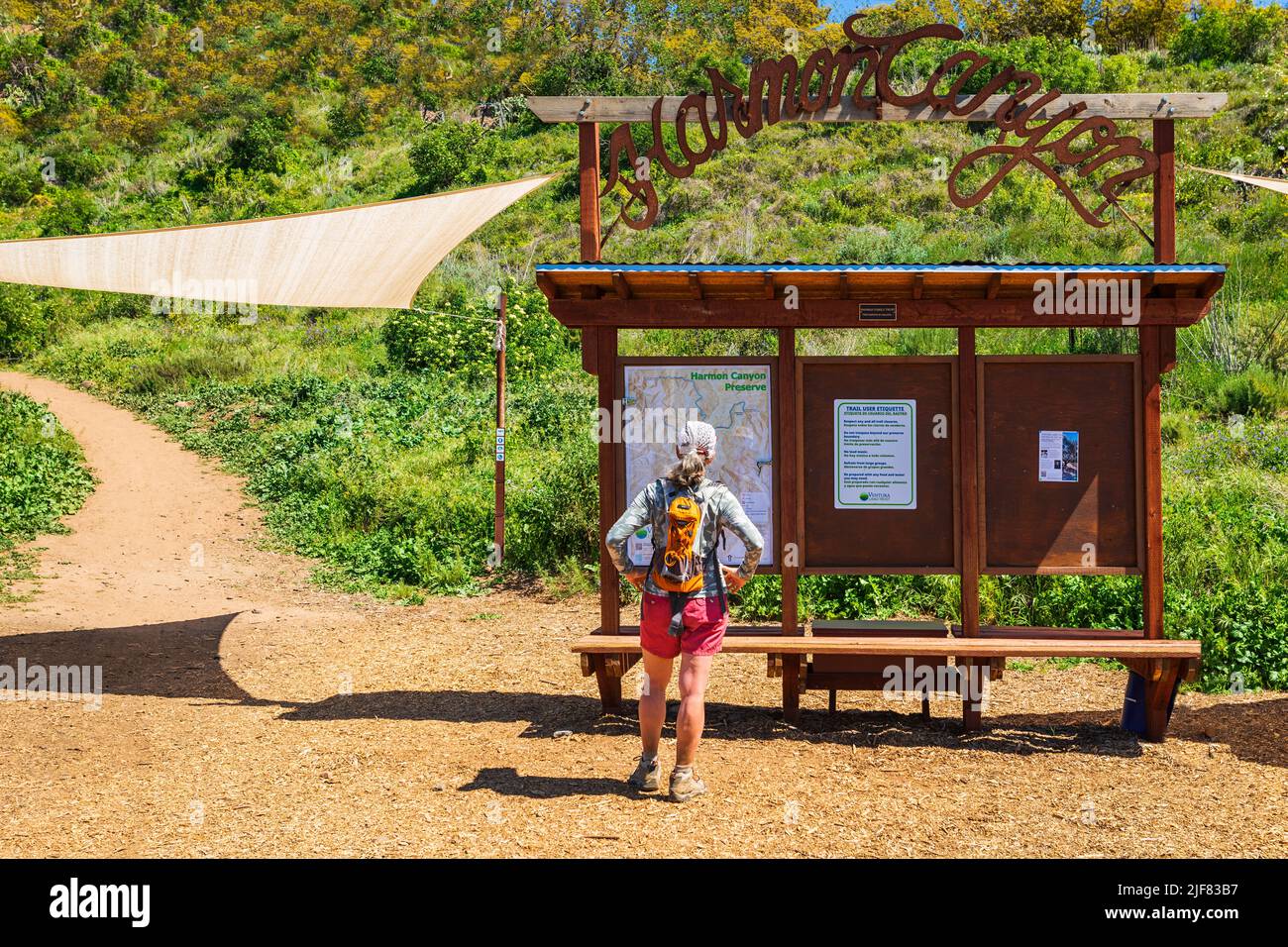 Interpretive signs and hiker at Harmon Canyon Preserve, Ventura ...