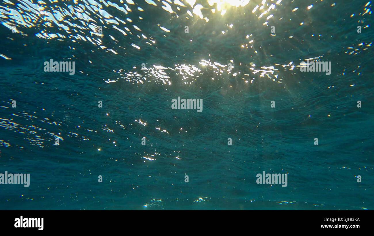 Sunrays penetrate through the surface of the water. Underwater light ...