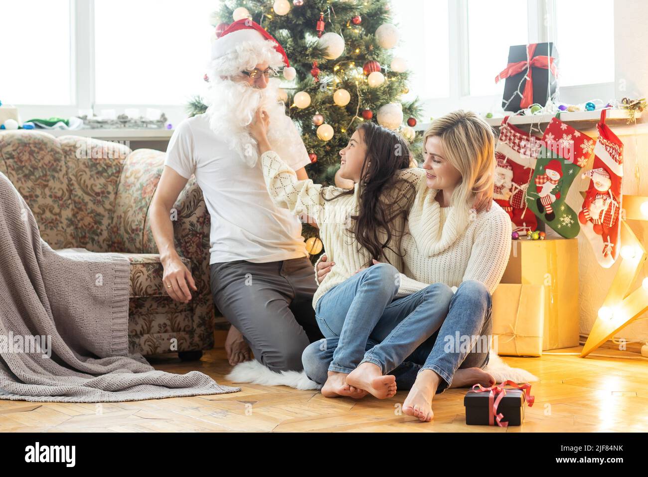 family and father in Santa costume, Christmas Stock Photo - Alamy