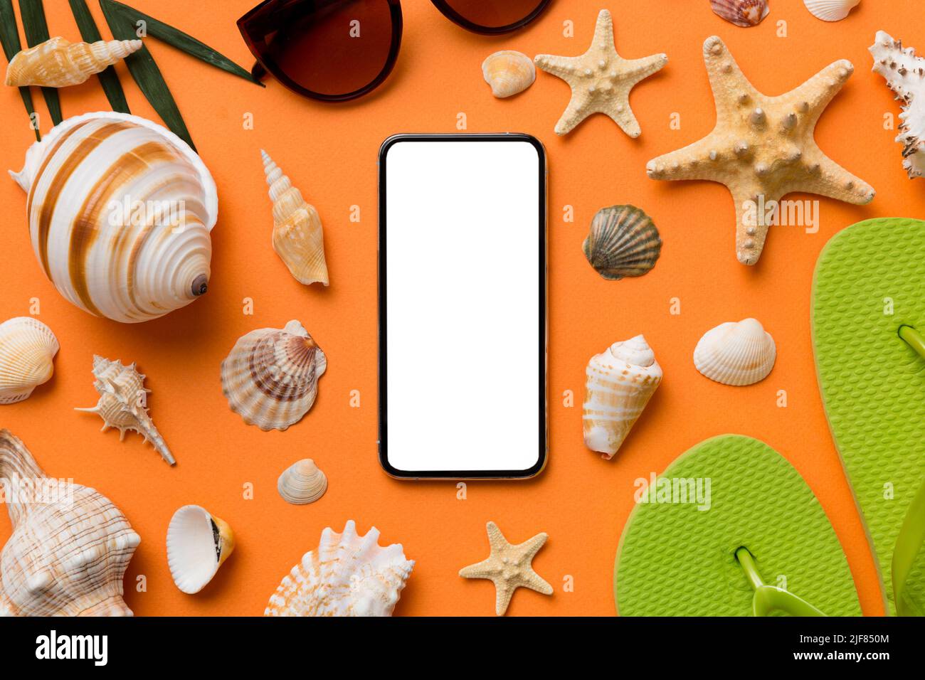 Flat lay composition with Phone and beach accessories on colored ...