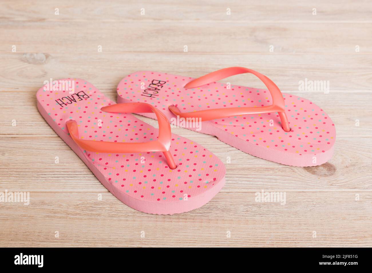 Beach accessories. Flip flops and starfish on colored background. Top ...