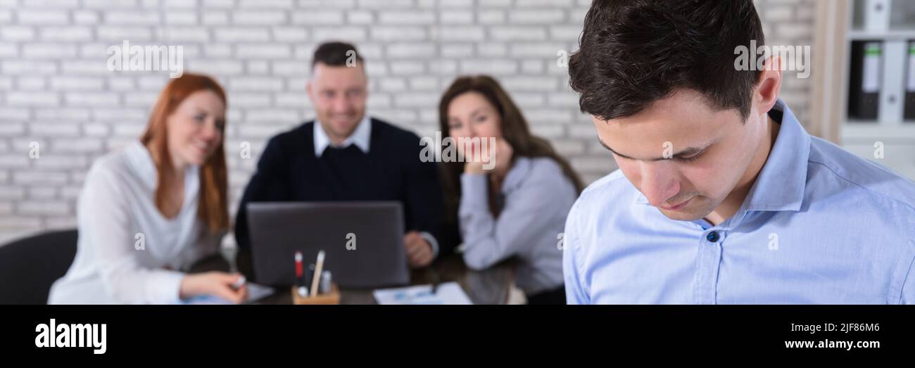 Portrait Of A Businessman With His Colleagues In Background At Office ...