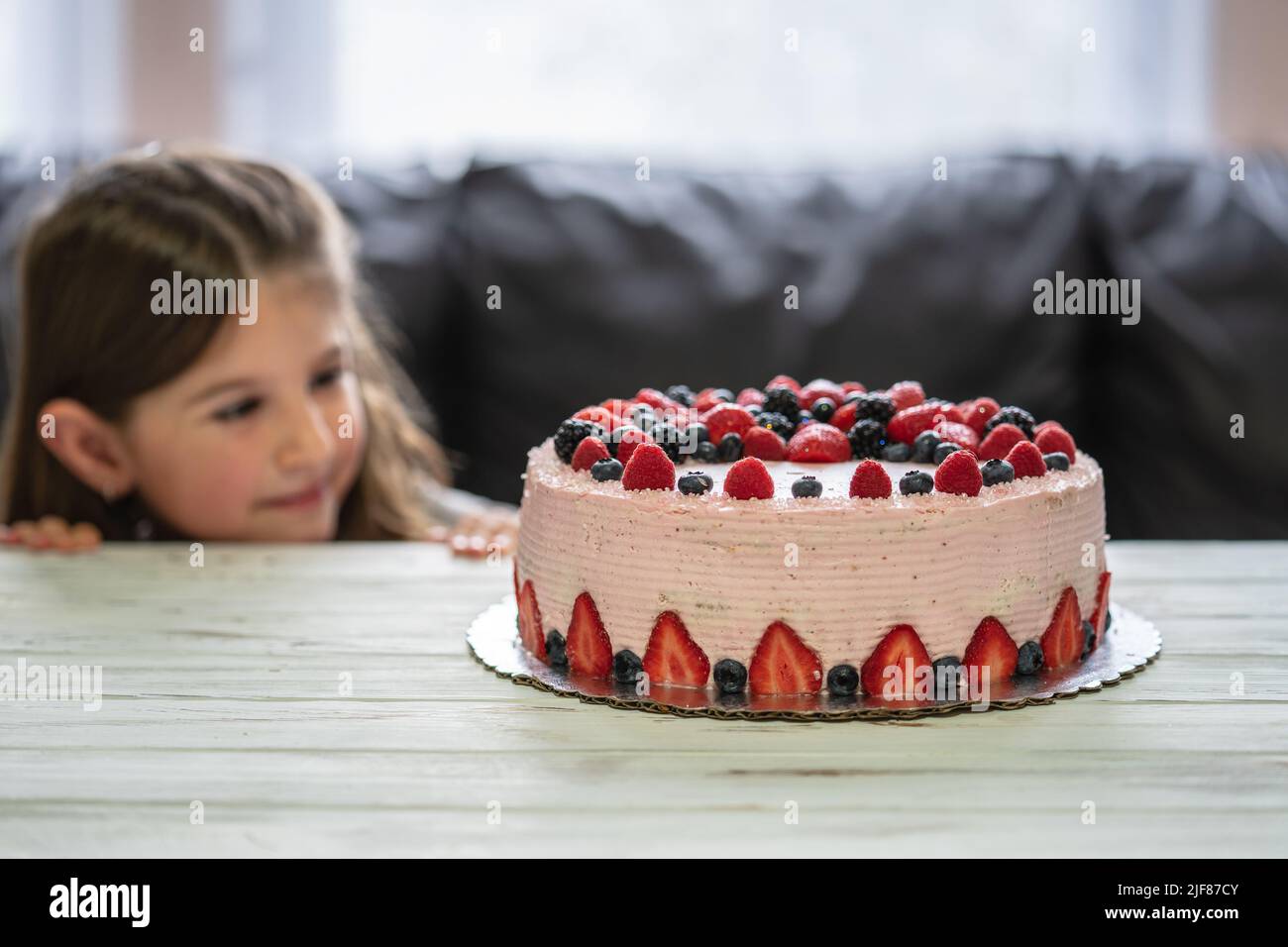 Little girl birthday cake.Home made cake with berries. Cake with ...