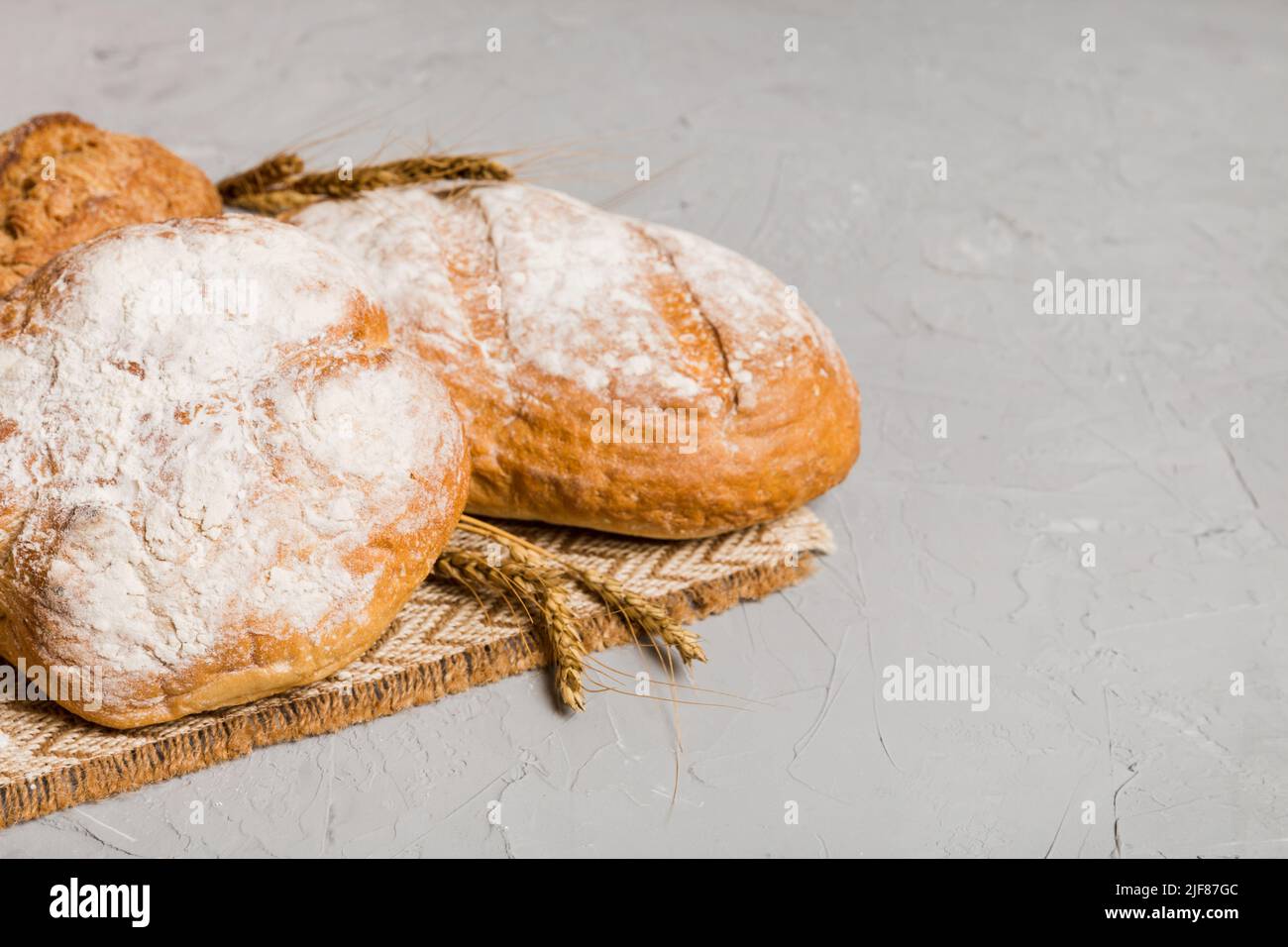 Homemade natural breads. Different kinds of fresh bread as background ...