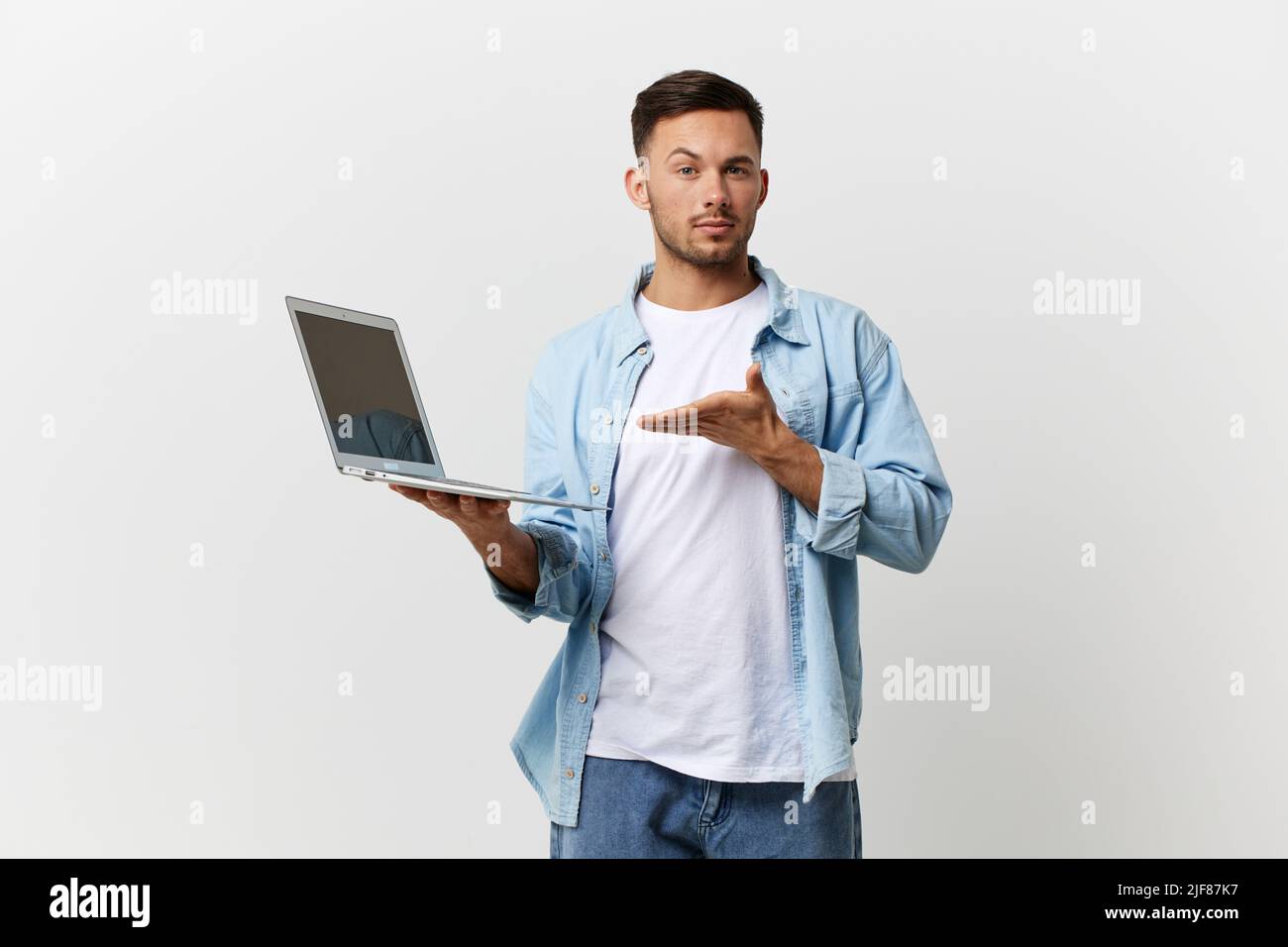 Serious friendly tanned handsome IT professional man in casual basic t ...