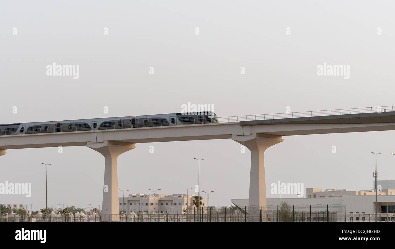 Doha, Qatar- June 06,2022 :Qatar red line metro traveling through the ...