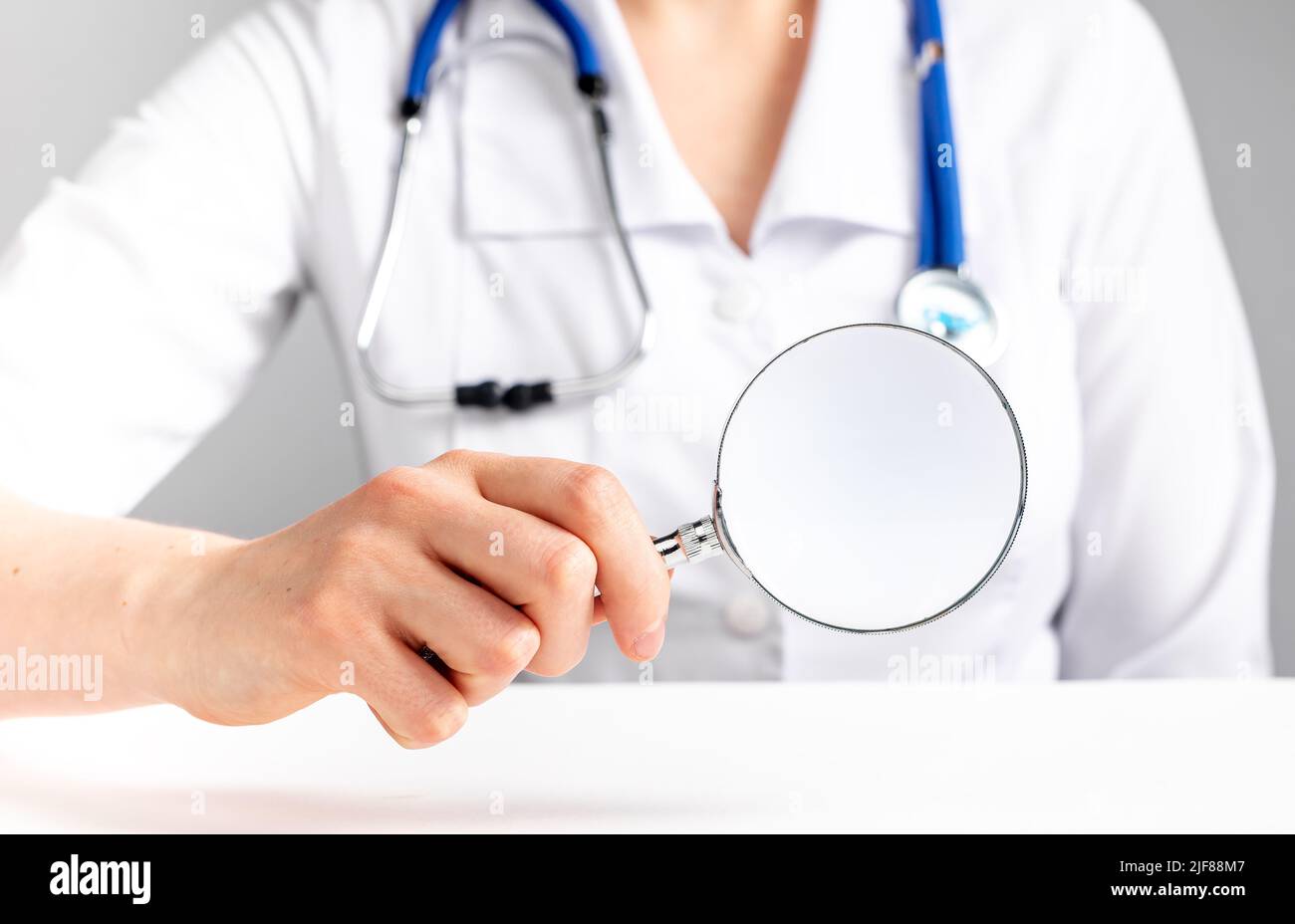 Magnifying glass doctor searching hi-res stock photography and images ...