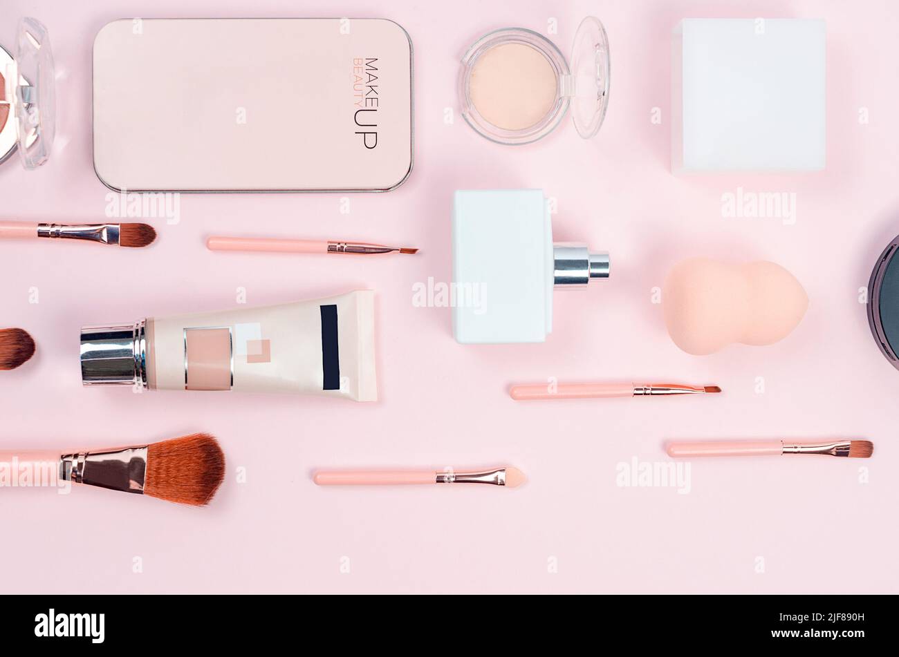 makeup Decorative cosmetic, brushes, tools and accessory on pastel pink ...