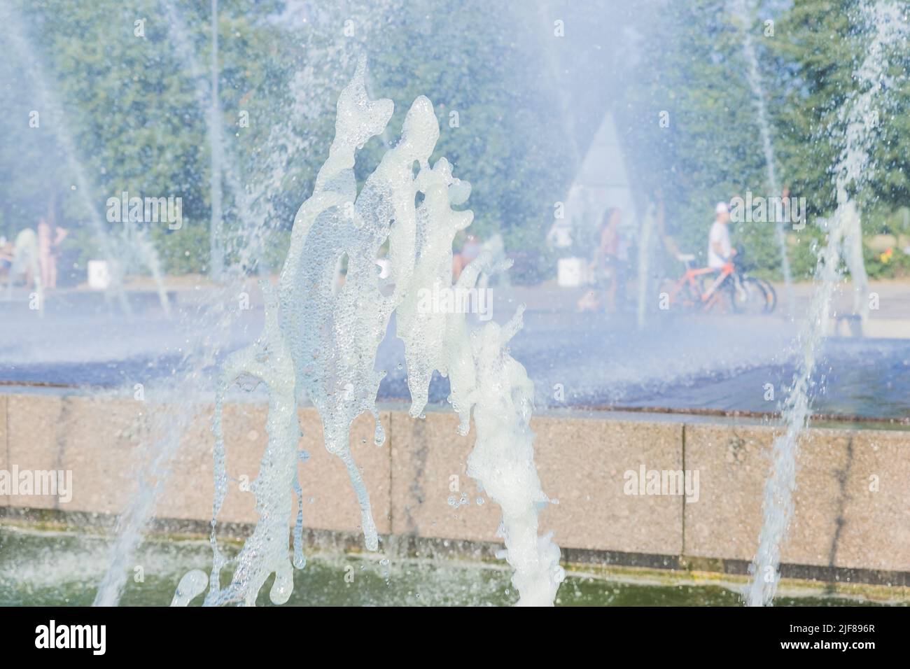 Clean water running from many taps with sparkling drops Stock Photo - Alamy