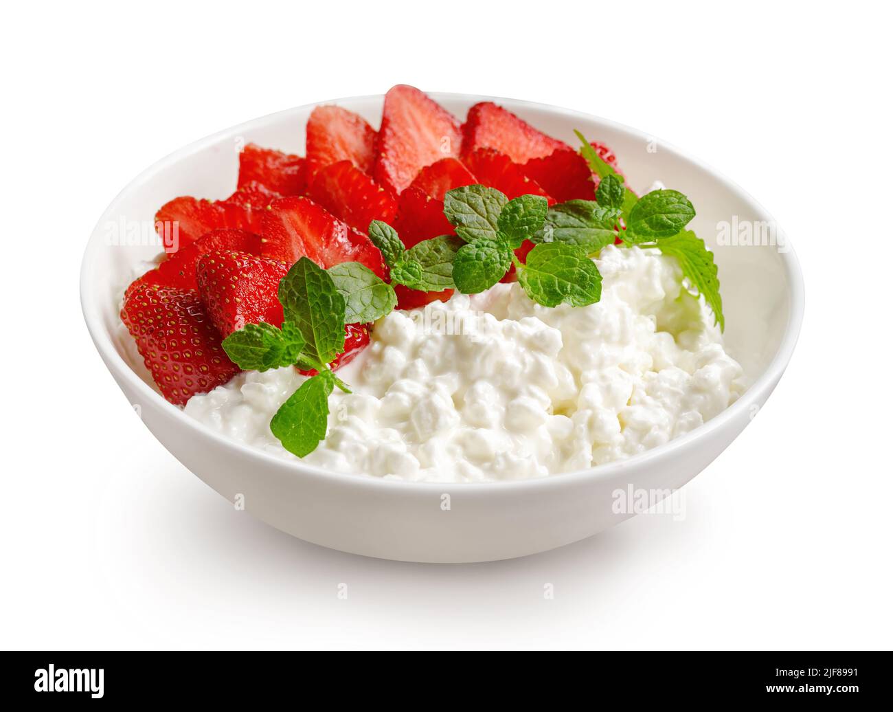 Soft cheese with strawberries in white bowl isolated on white Stock ...