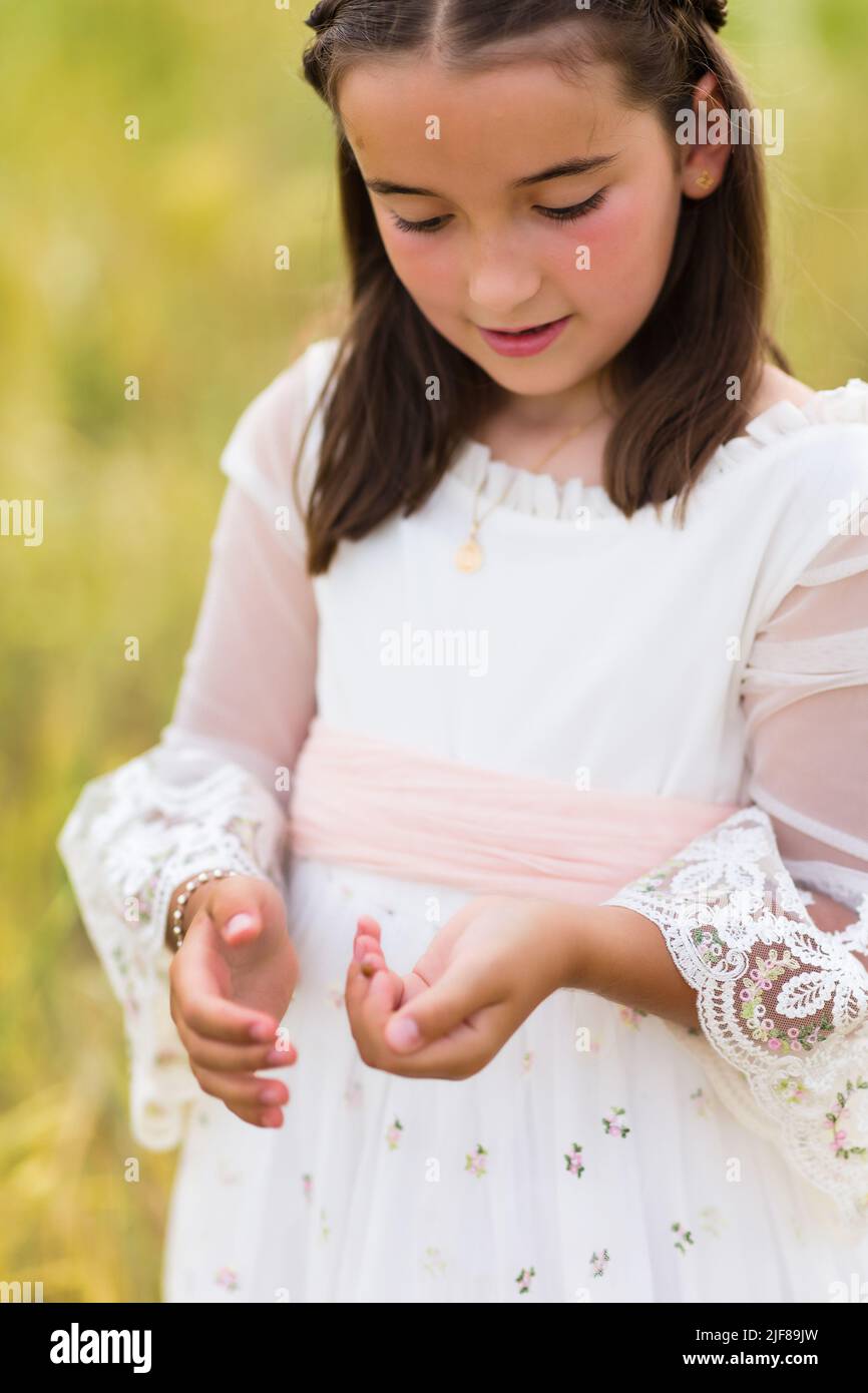 communion girl play with ladybug, child religion catholic celebration ...