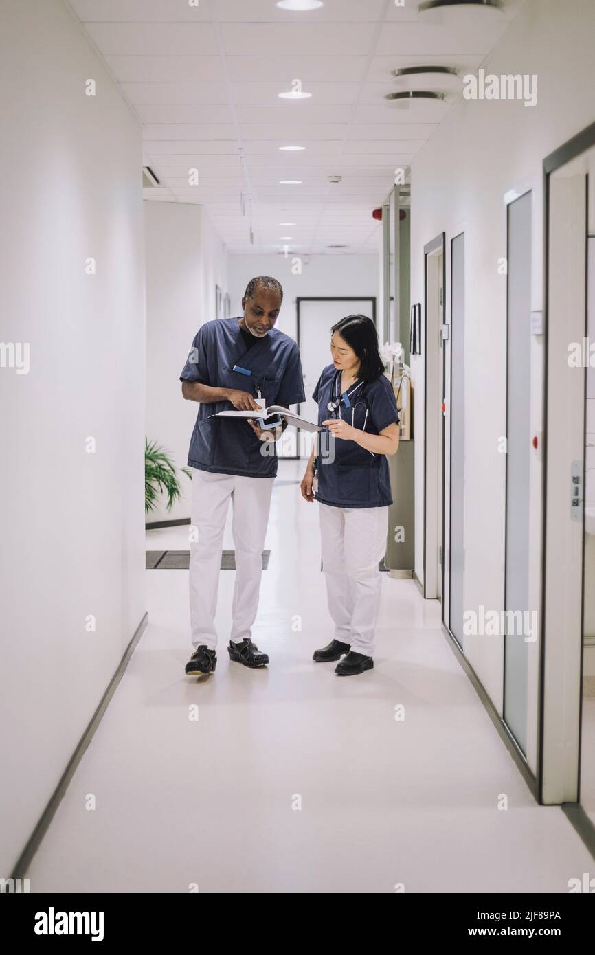 African doctor discussing medical report hi-res stock photography and ...