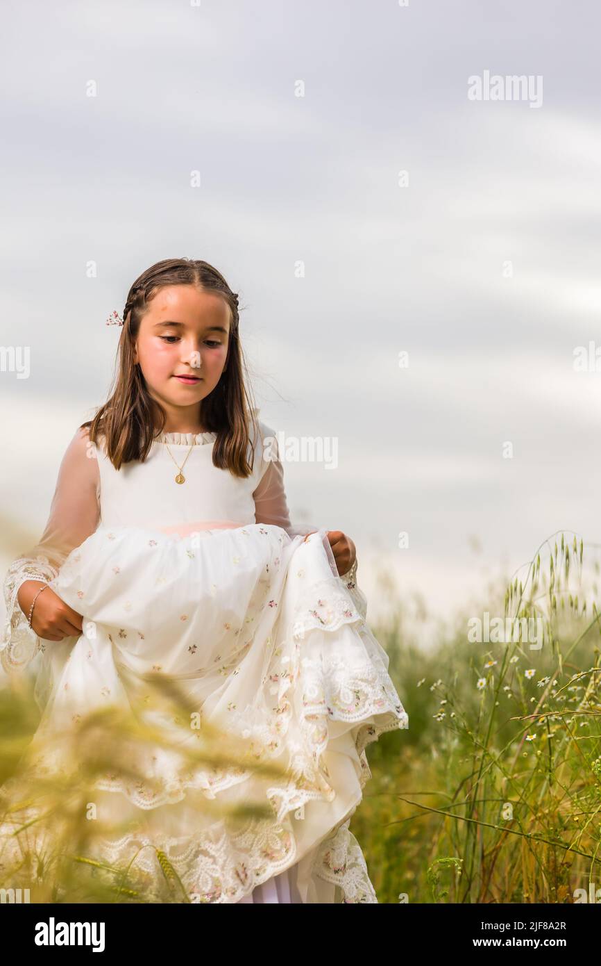 religious catholic child celebration. Hispanic girl in communion ...