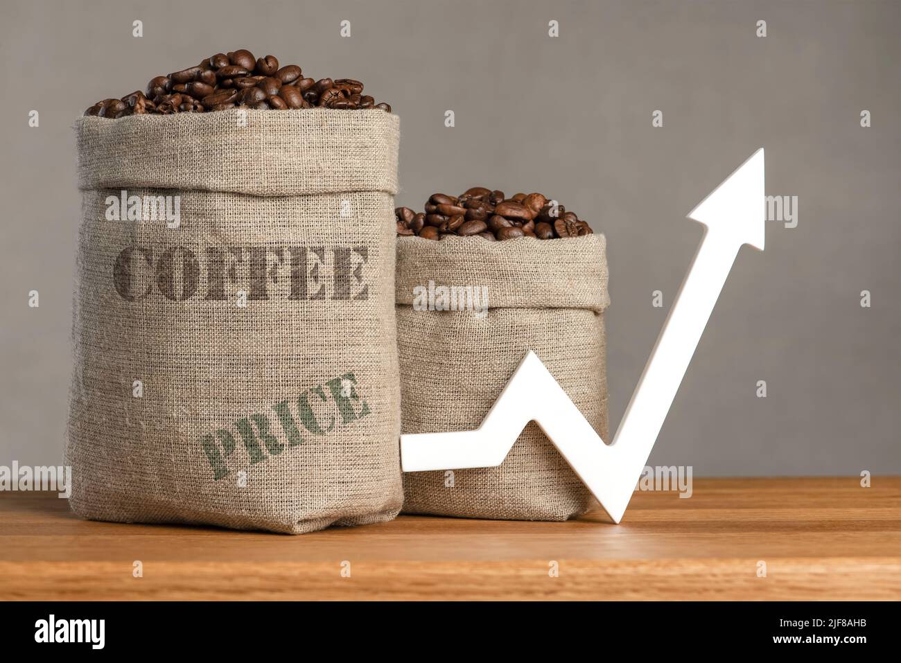 A bag of coffee beans and a chart arrow pointing up. The cost of coffee ...