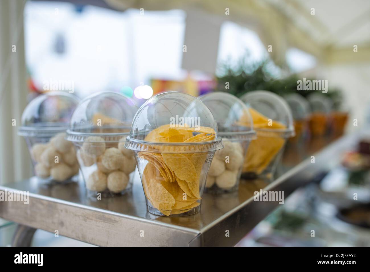 snacks for beer in plastic packaging, chips in a cup Stock Photo - Alamy
