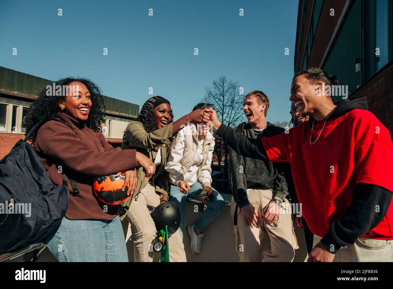 Fist bump teenagers hi-res stock photography and images - Alamy